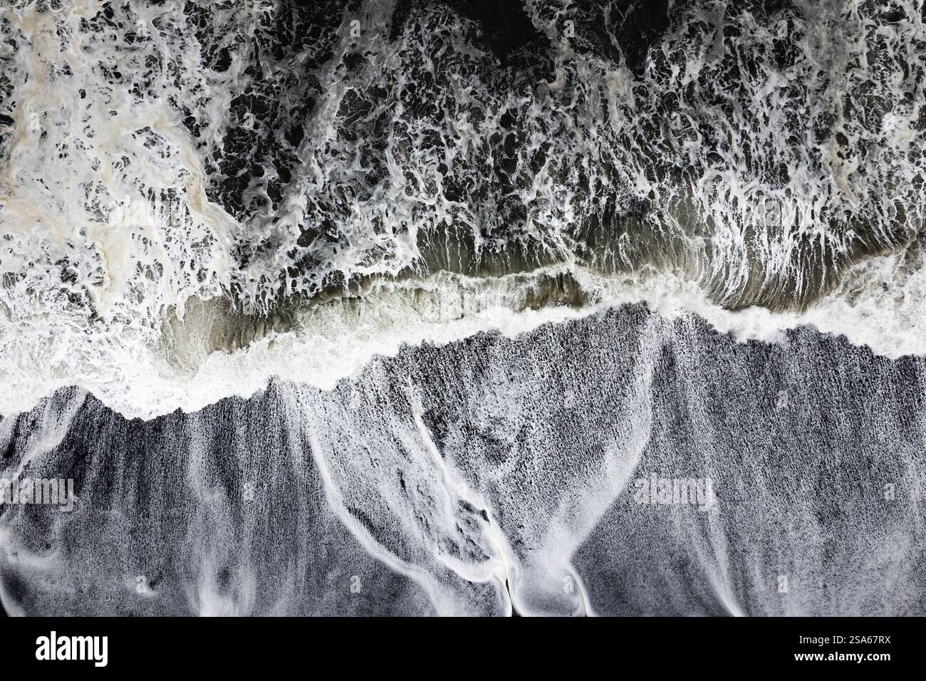 Aerial drone view of epic ocean waves crashing on the shoreline black ...