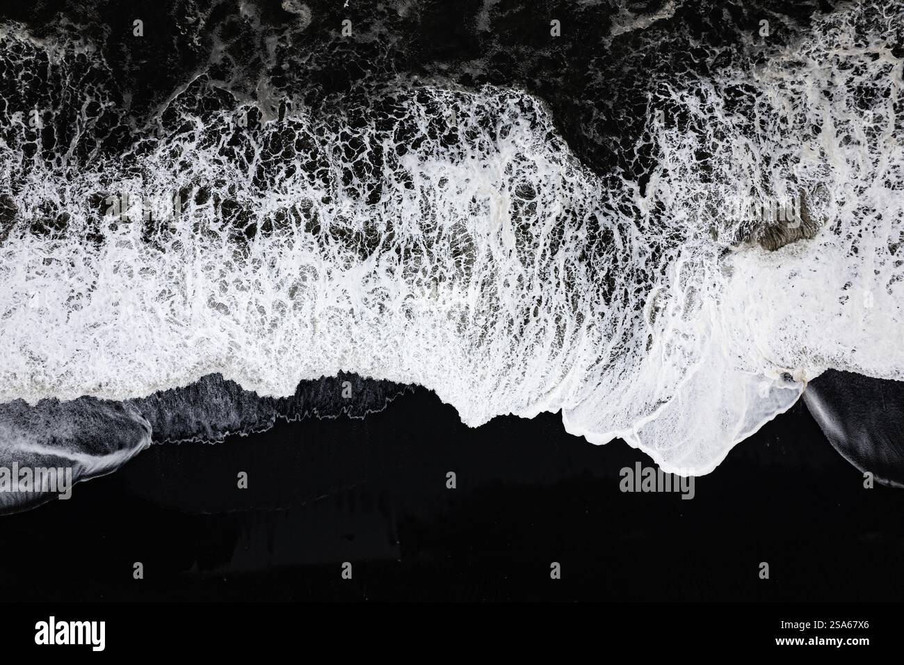 Aerial drone view of epic ocean waves crashing on the shoreline black ...