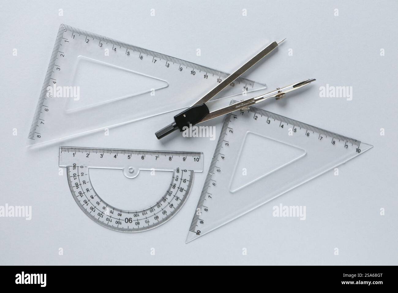 Rulers and compass on light grey background, flat lay Stock Photo - Alamy