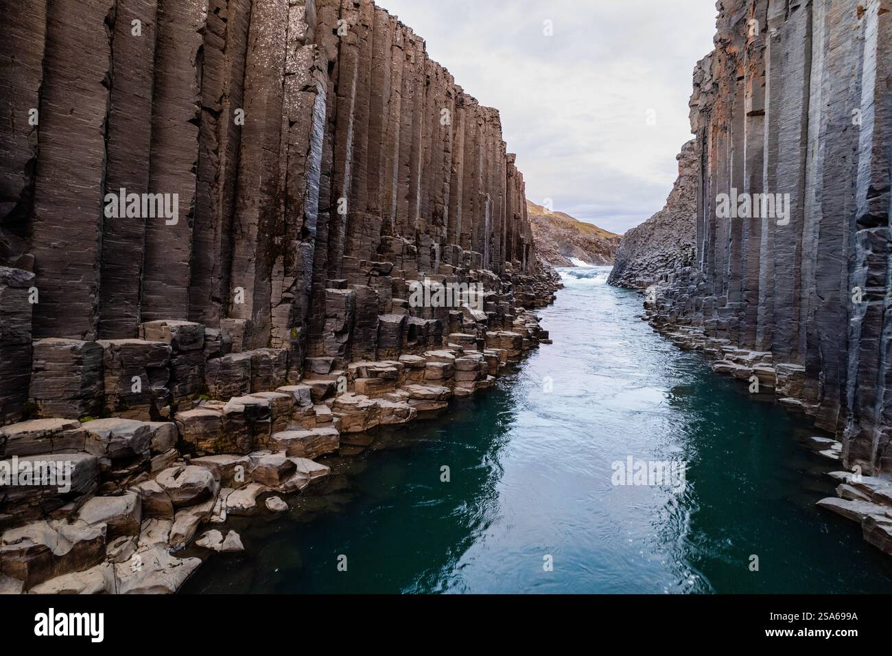 Aerial view of basalt Studlagil Canyon with clear Jokulsa a Dal river ...