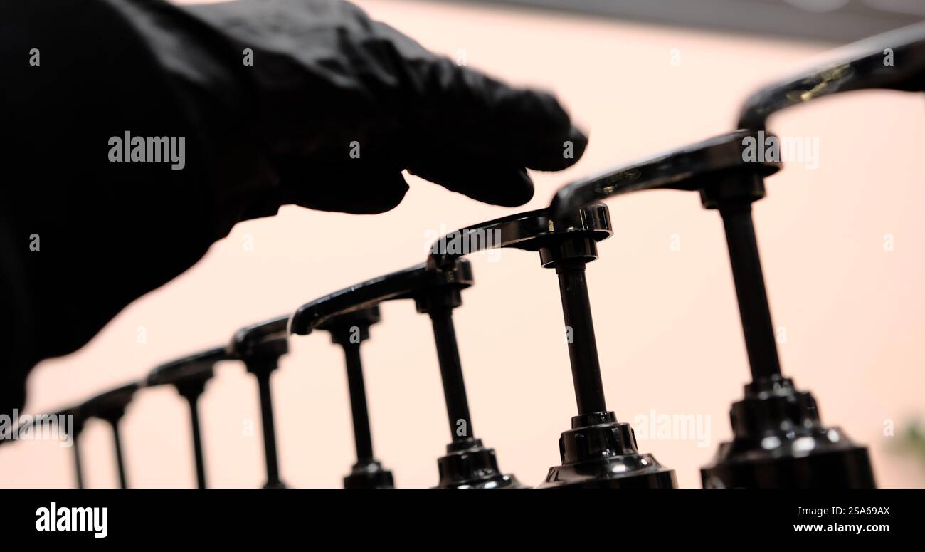 barista black rubber gloves presses syrup dispenser adding flavor to ...