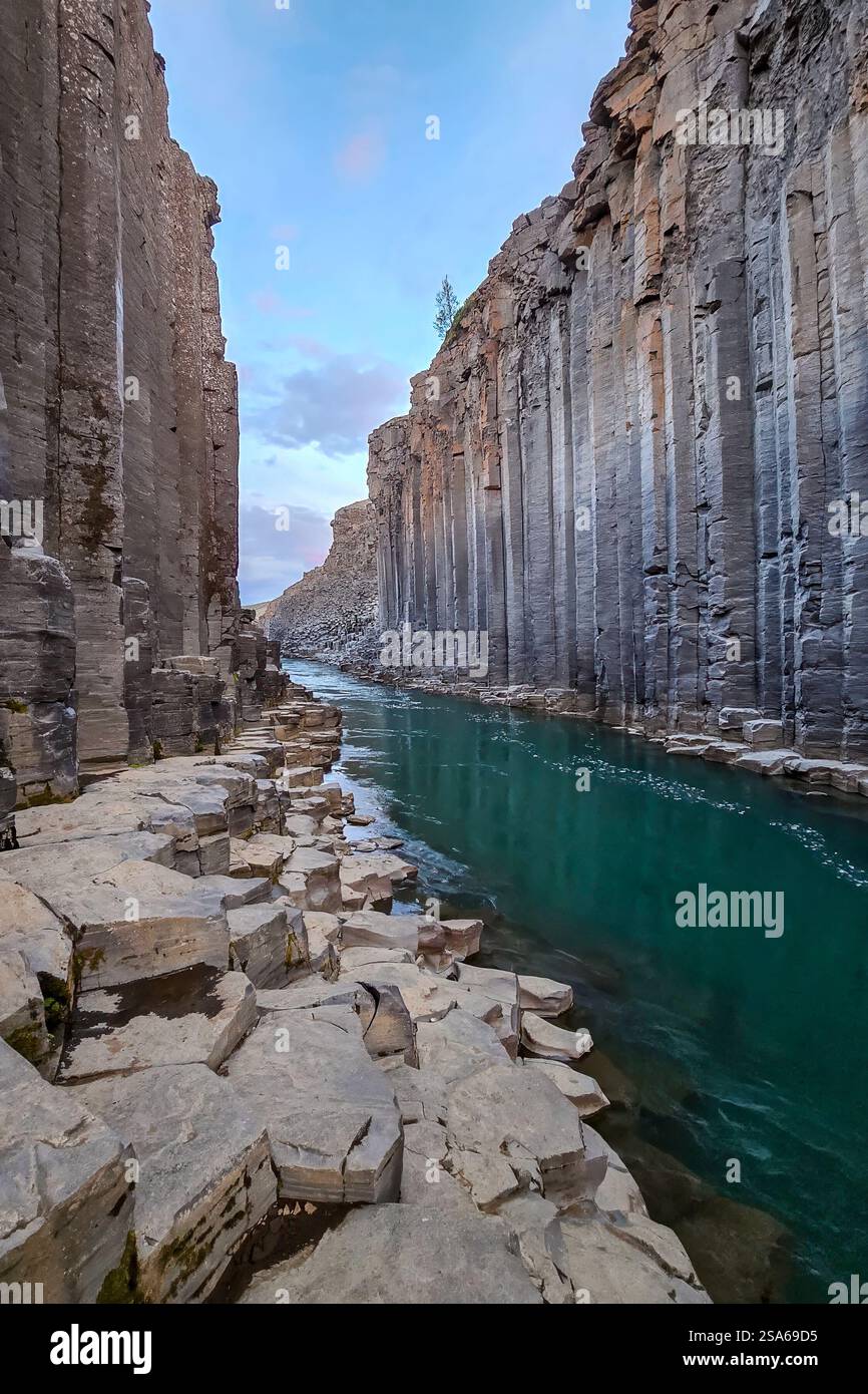 Aerial view of basalt Studlagil Canyon with clear Jokulsa a Dal river and unique columnar basalt ...