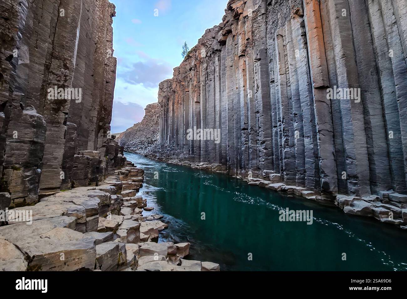 Aerial view of basalt Studlagil Canyon with clear Jokulsa a Dal river ...
