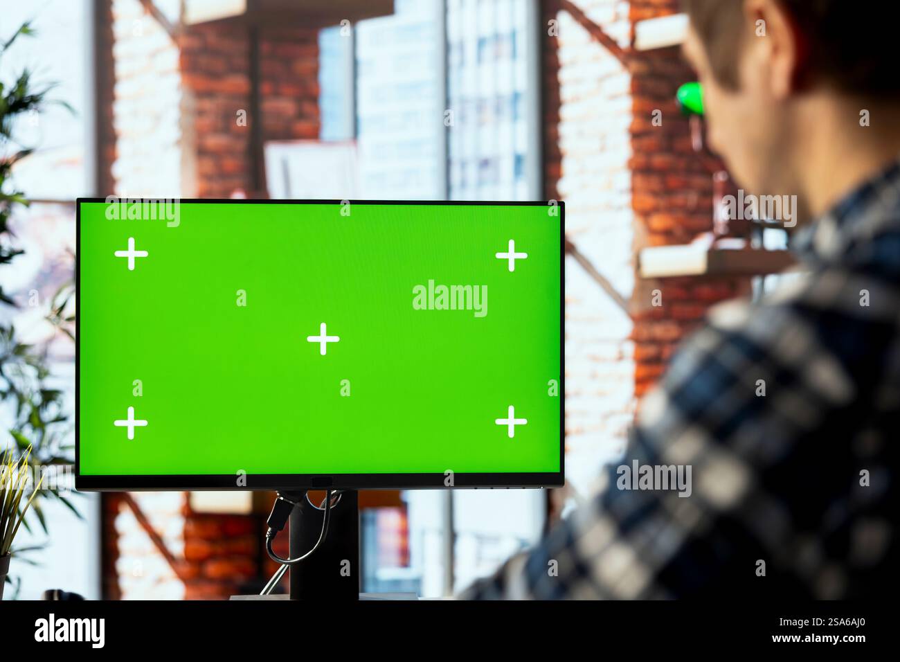 Employee at home office desk looking mockup computer display, composing ...
