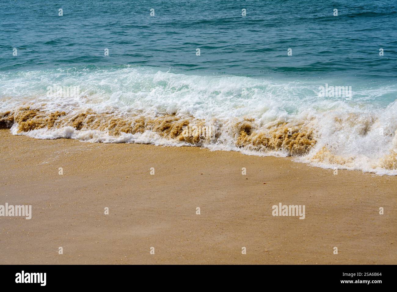 Stunning Sandy Beach with Clear Blue Waters and Gentle Waves Under a ...