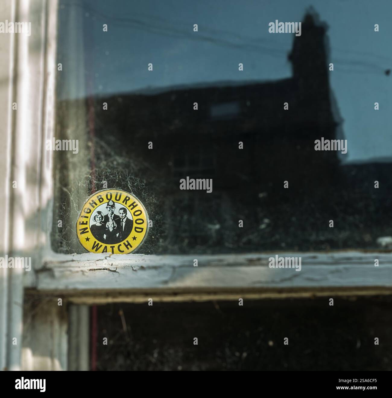 Vintage 1980s neigbourhood watch sign displayed in an old window frame ...