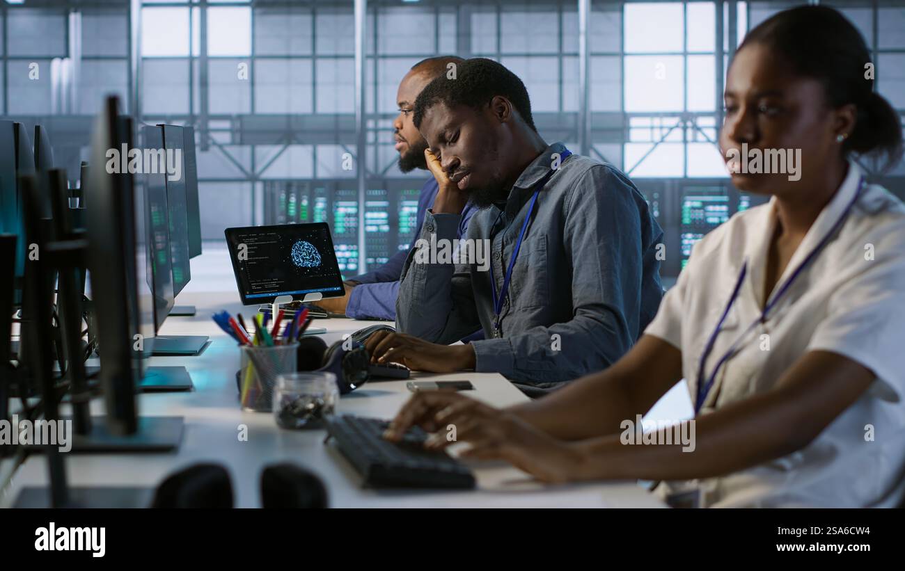 Tired data center engineer yawning hi-res stock photography and images ...