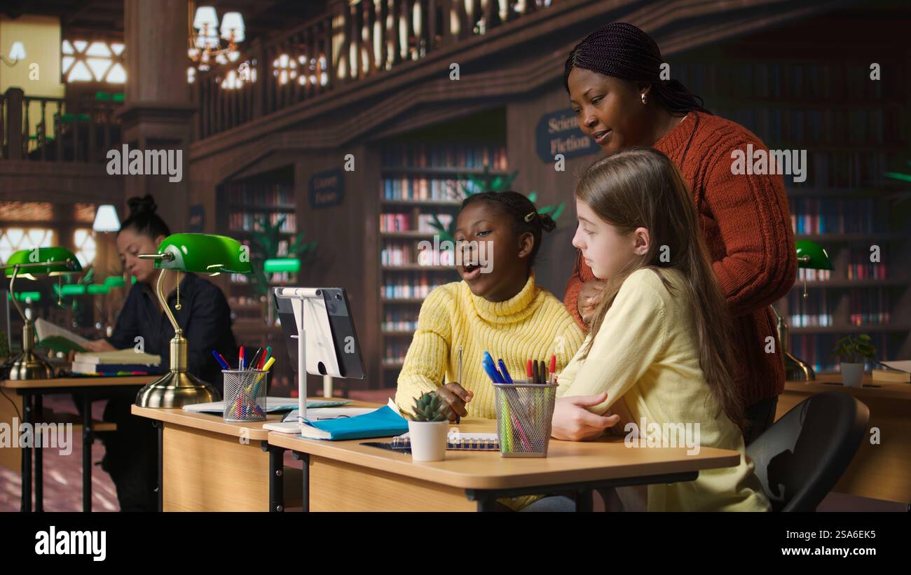 Classmates friends doing a school team project with teacher while on ...