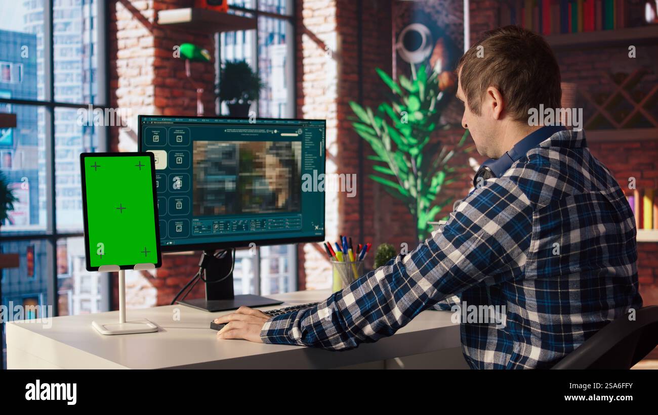 Man looks green screen tablet hi-res stock photography and images - Alamy