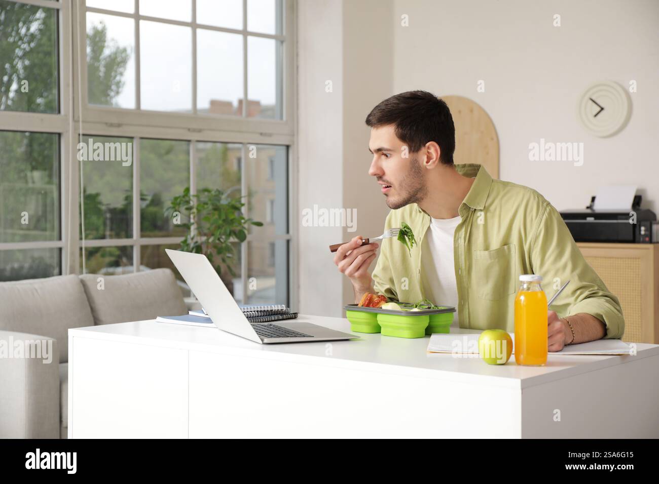 Young man lunchbox sitting hi-res stock photography and images - Alamy
