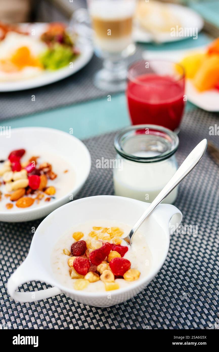 Delicious healthy breakfast oatmeal with nuts and dried fruits Stock ...