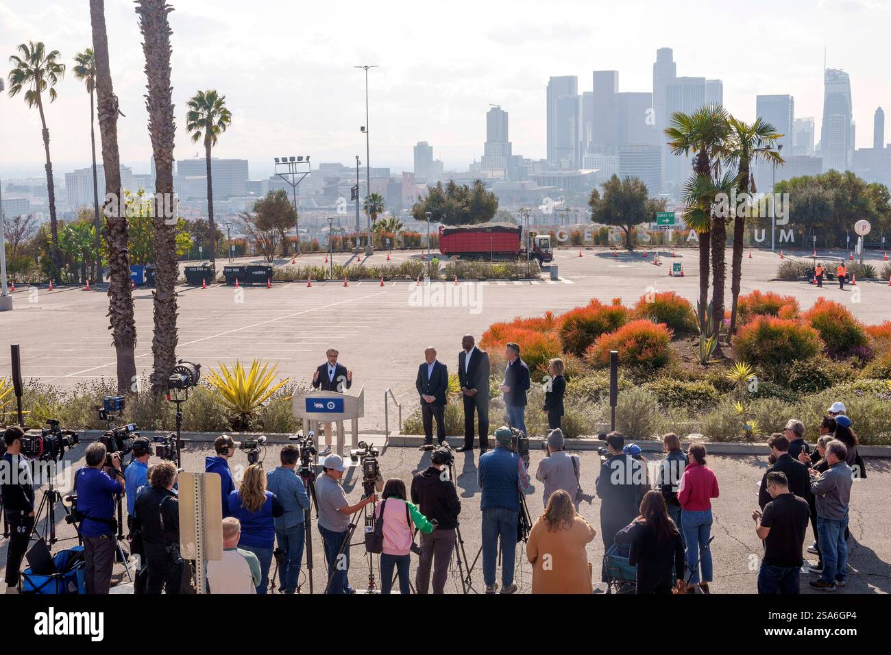 2028 Olympics organizer Casey Wasserman, at podium, introduces Dodgers ...