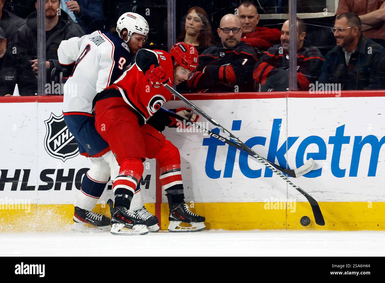 Carolina Hurricanes' Jordan Martinook (48) protects the puck from ...