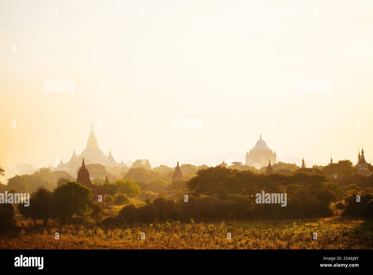 Scenic sunset with thousands of historic buddhist temples and stupas in ...