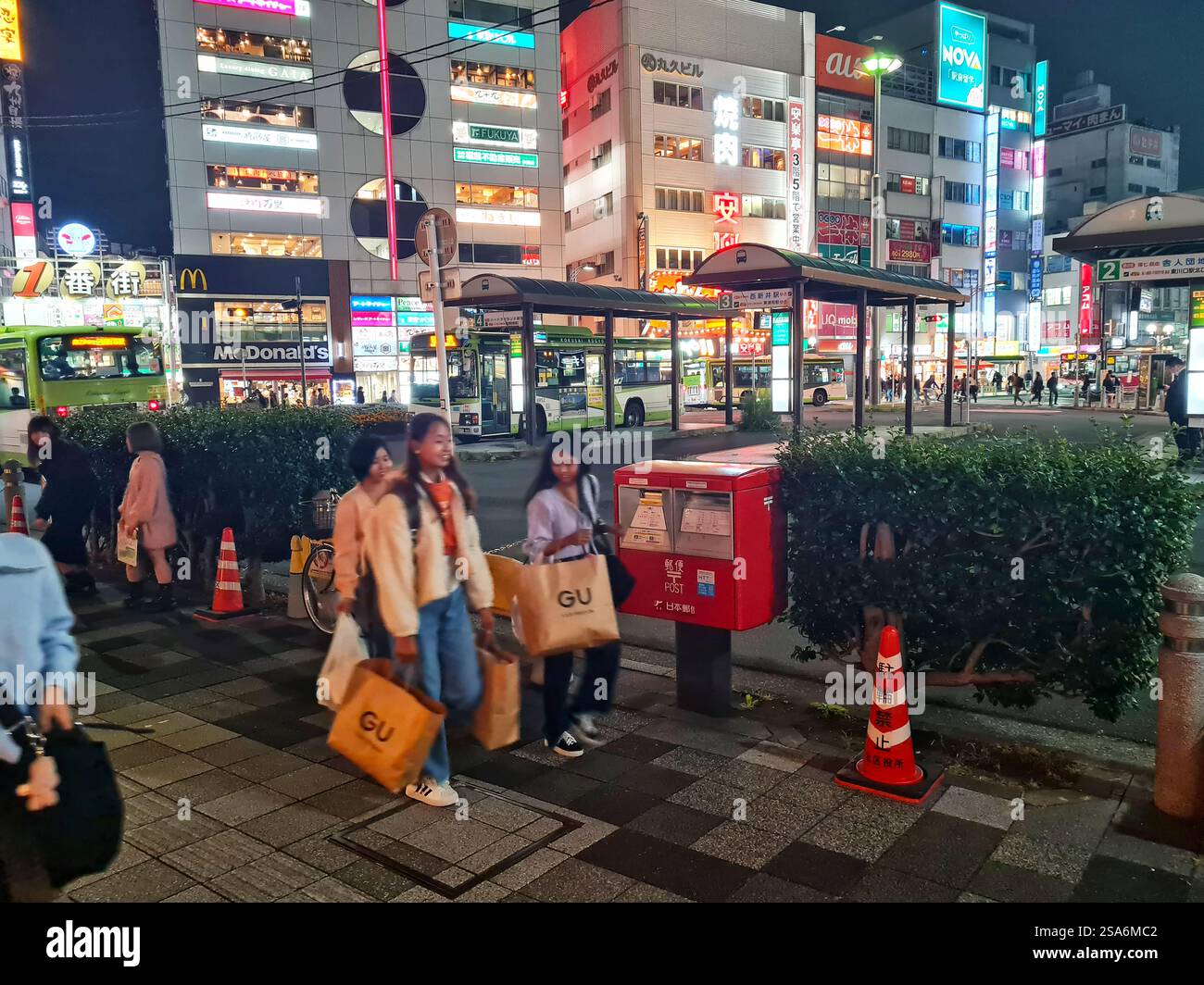 Night scene outside Akabane Station in Tokyo, Japan with shops and ...