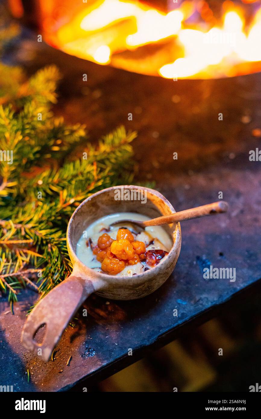 Delicious Lappish baked cheese with cloudberry jam served in wooden ...