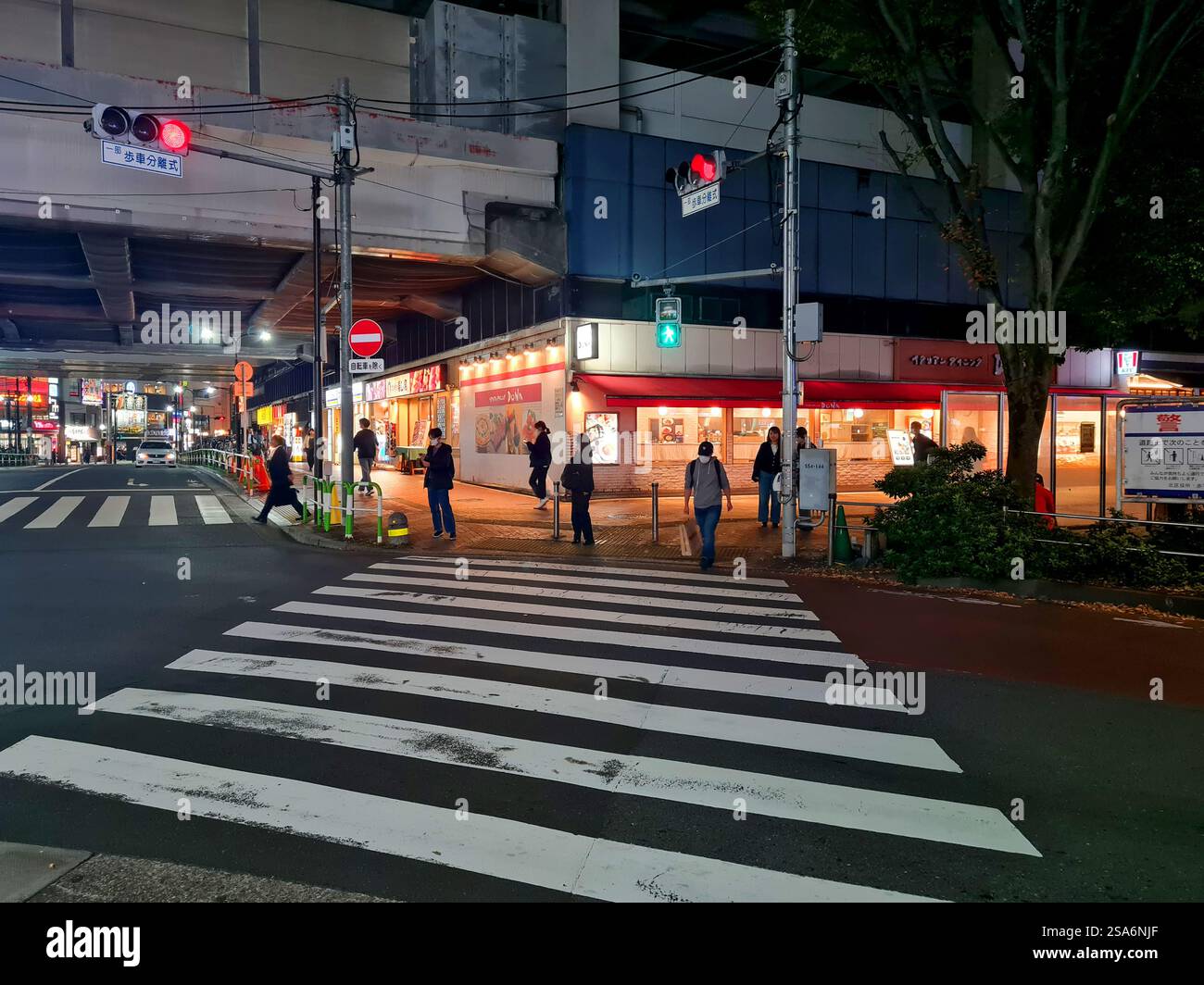 Night scene in Akabane near the train station in Tokyo, Japan with a ...