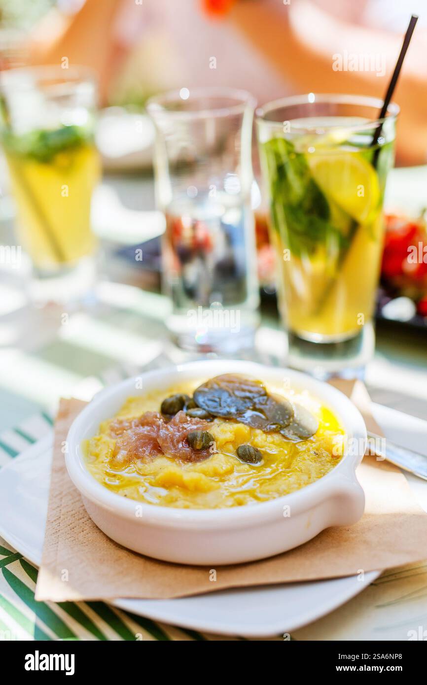 Authentic greek fava dish served with anchovies for lunch or dinner in ...