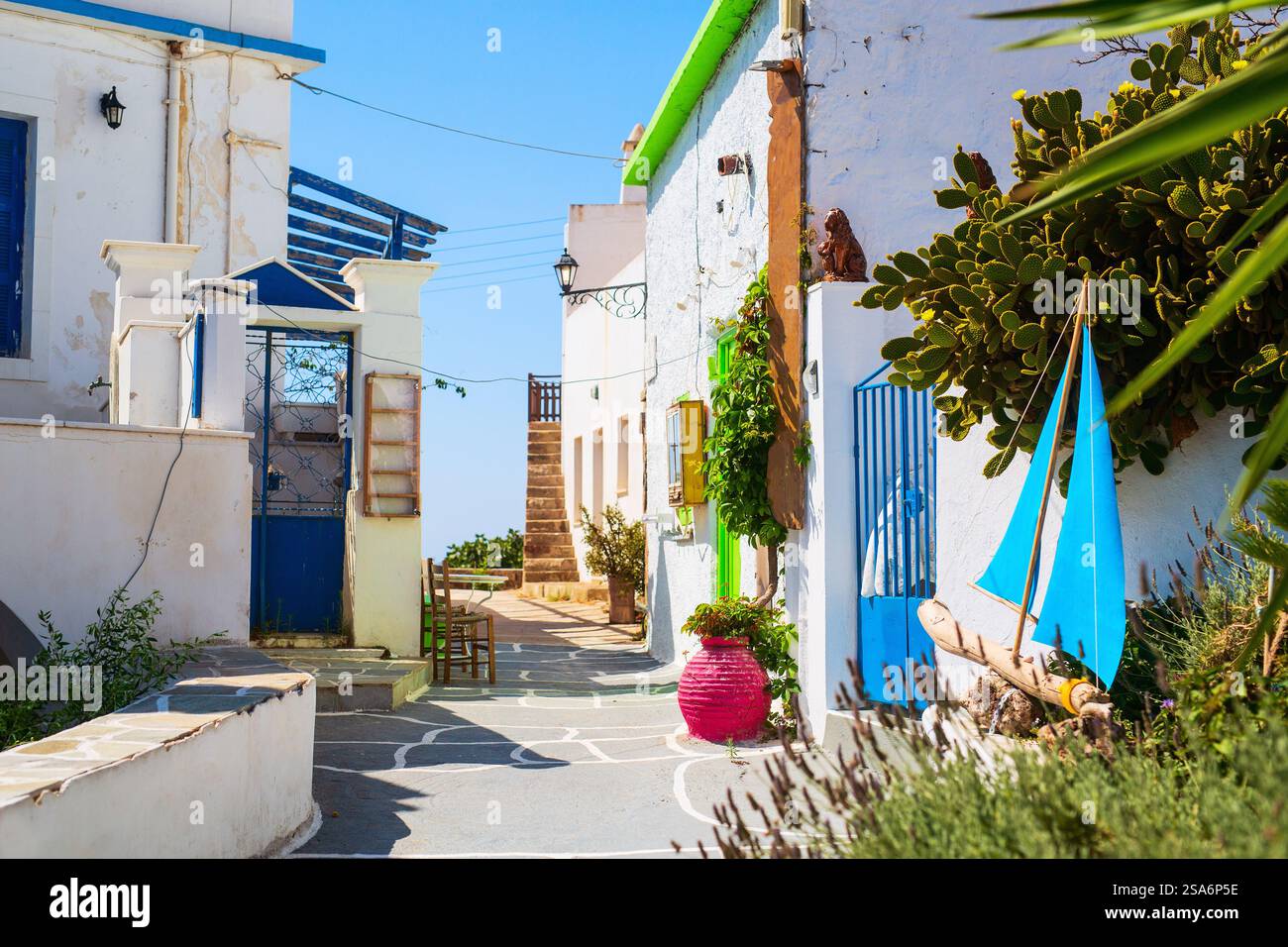 Beautiful street in old traditional Greek cycladic village of Tripiti ...