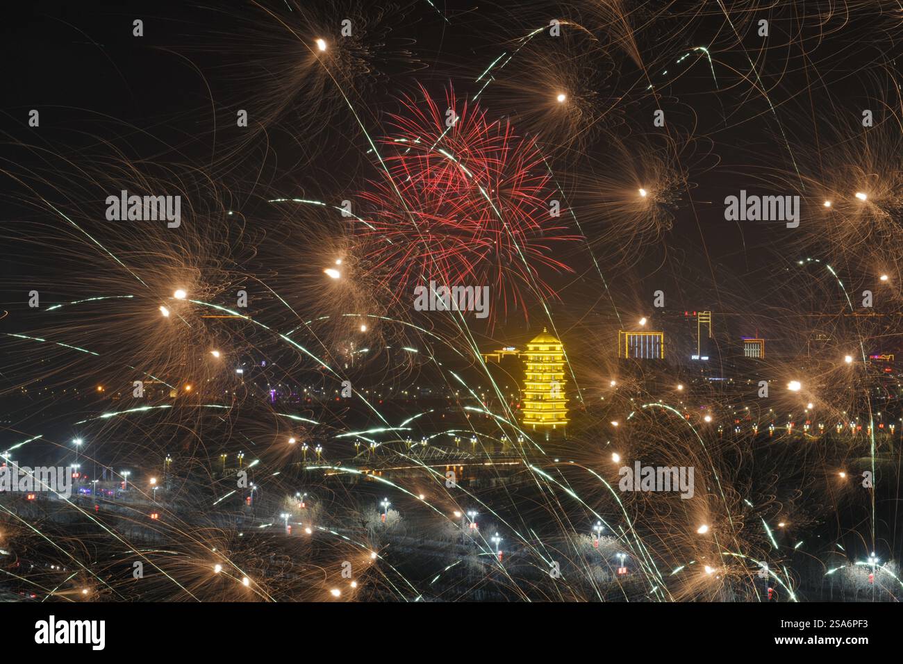 KORLA, CHINA - JANUARY 28, 2025 - People hold a fireworks and light ...
