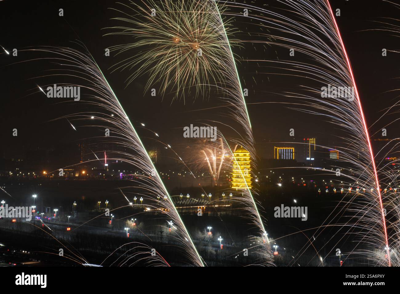 KORLA, CHINA - JANUARY 28, 2025 - People hold a fireworks and light ...