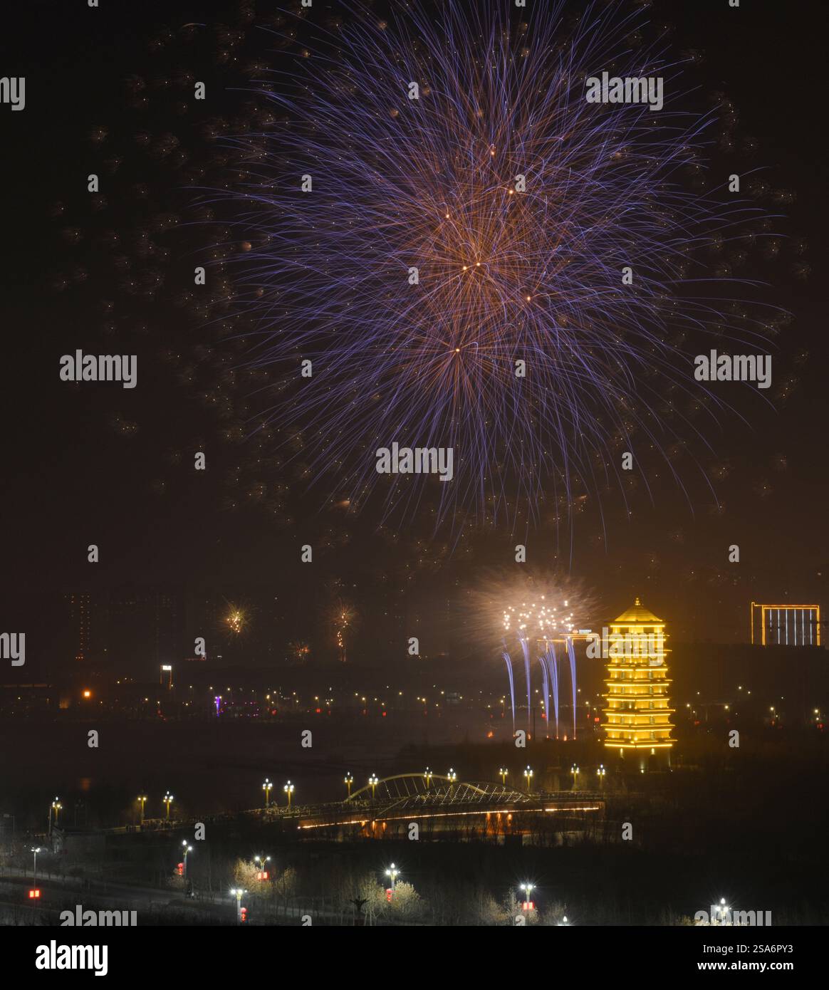 KORLA, CHINA - JANUARY 28, 2025 - People hold a fireworks and light ...