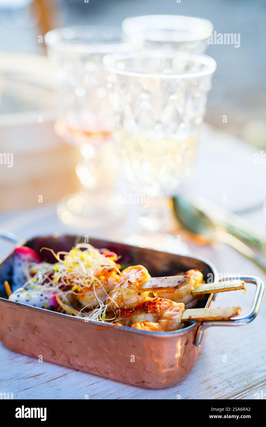 Grilled satay shrimp skewers served for lunch Stock Photo - Alamy