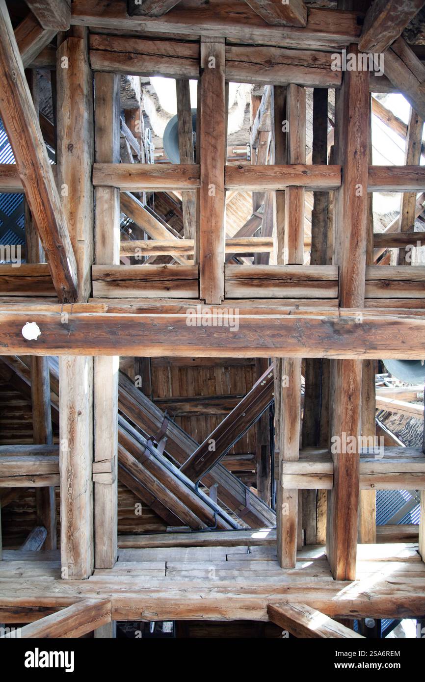 Bottom up view of old wooden beams in a medieval clock tower Stock ...