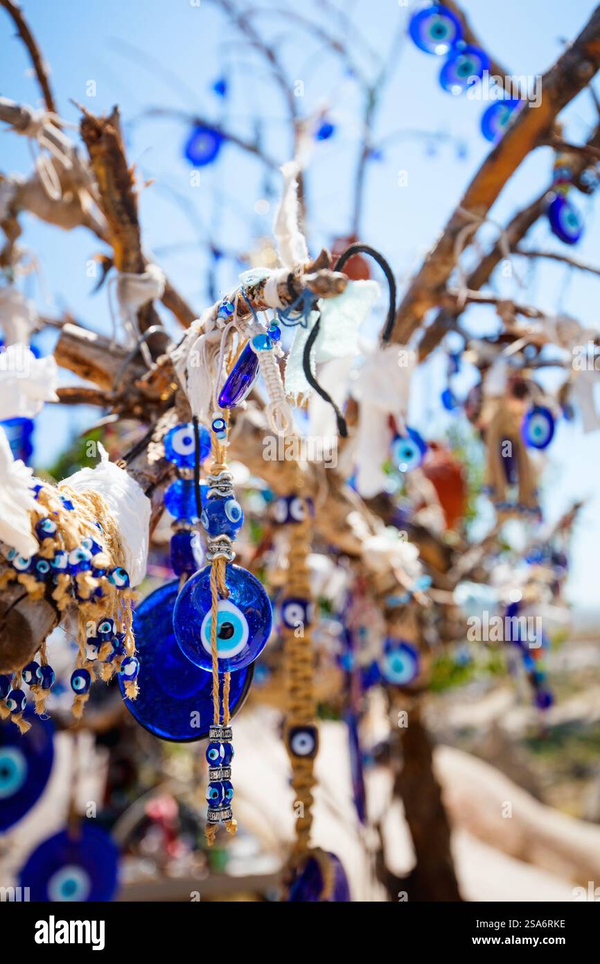 Evil eye charms hang from tree in Cappadocia Turkey for good luck Stock ...