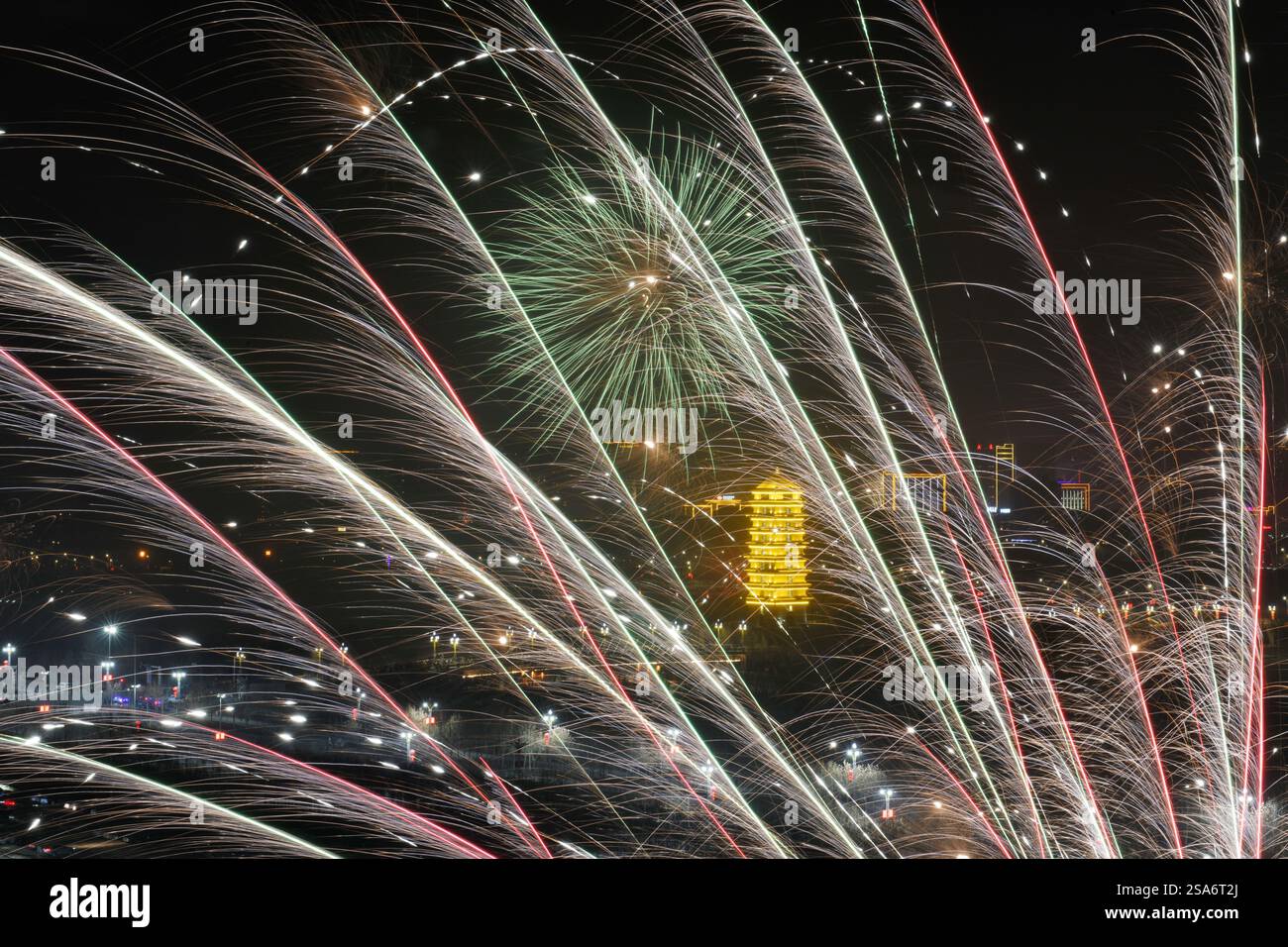 KORLA, CHINA - JANUARY 28, 2025 - People hold a fireworks and light ...