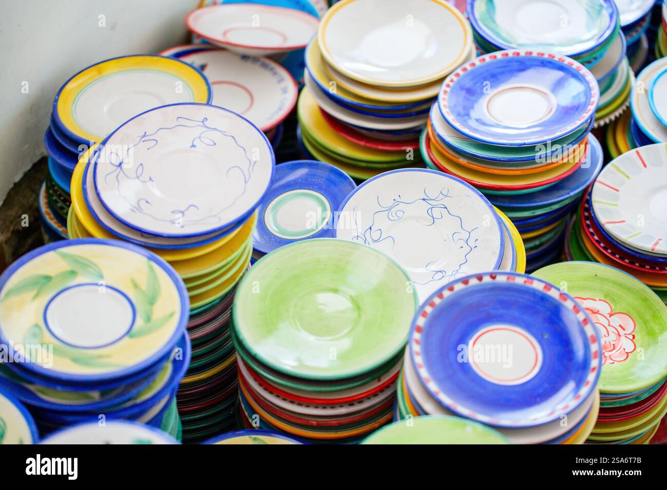 Colorful small dishes in ceramic factory in Italy Stock Photo - Alamy