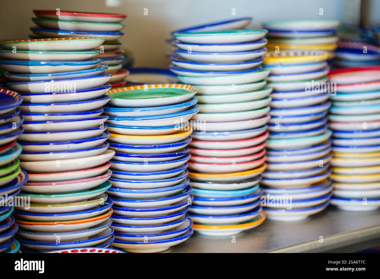 Colorful small dishes in ceramic factory in Italy Stock Photo - Alamy