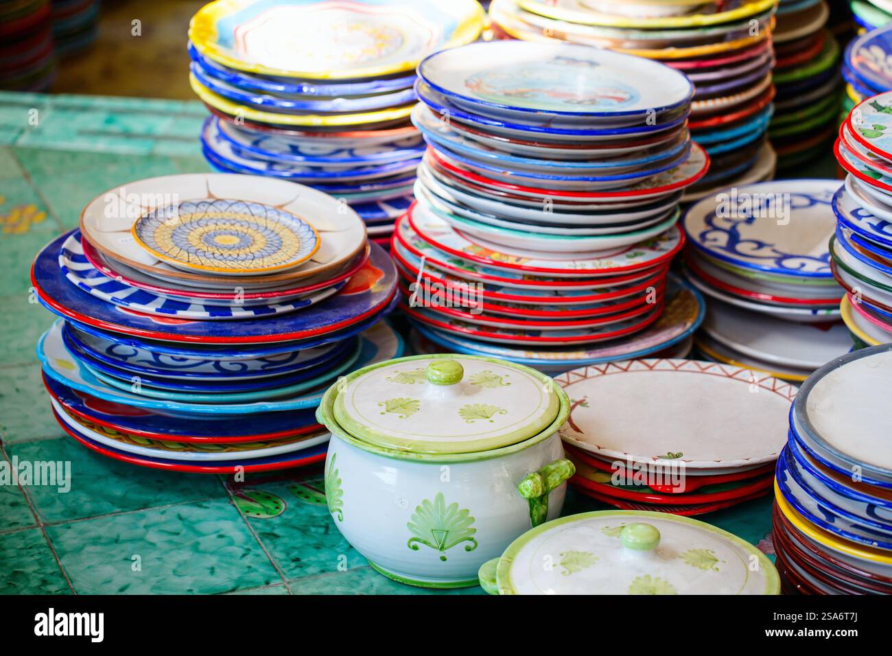Colorful small dishes in ceramic factory in Italy Stock Photo - Alamy