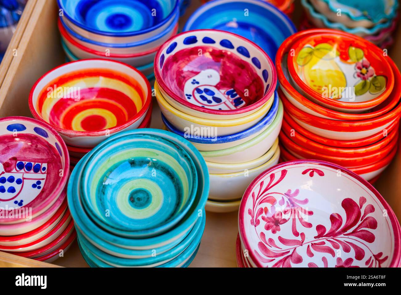 Colorful small dishes in ceramic factory in Italy Stock Photo - Alamy