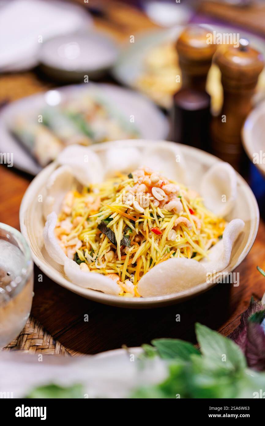 Fresh delicious vietnamese green mango salad Stock Photo - Alamy