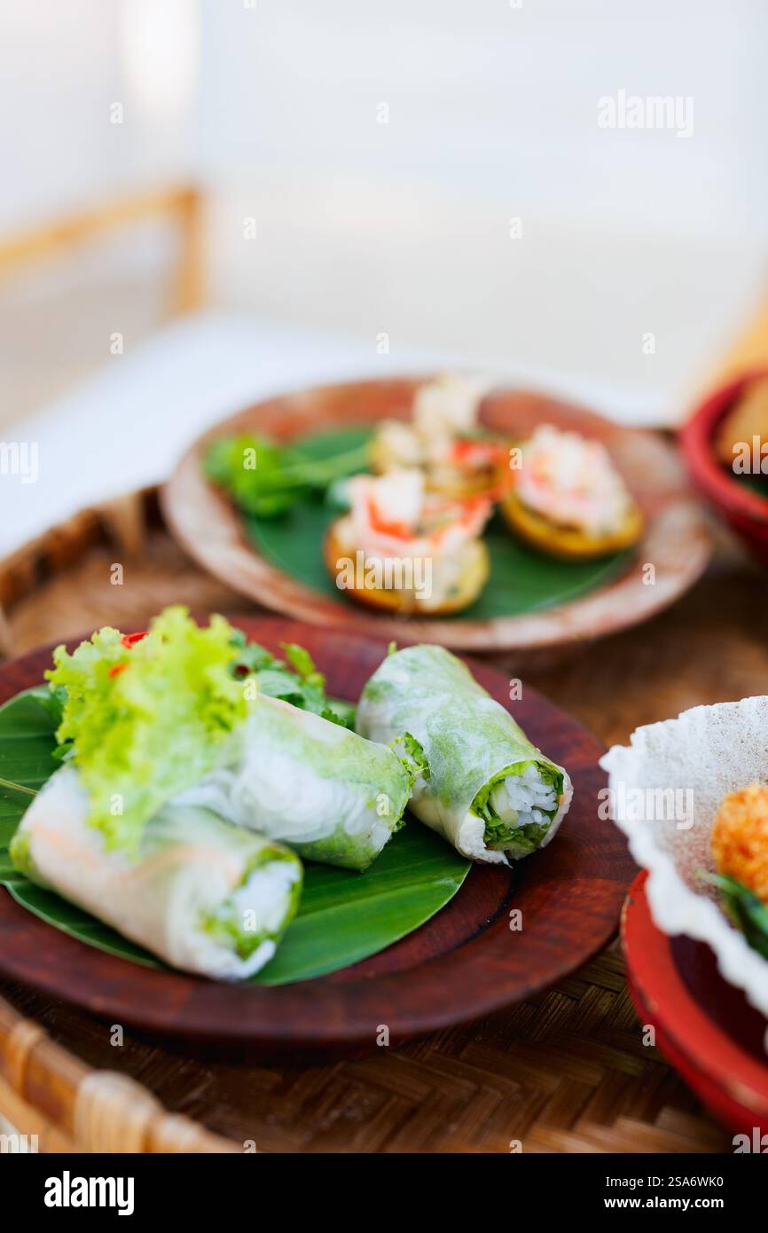 Traditional vietnamese spring rolls served with other small bites for ...