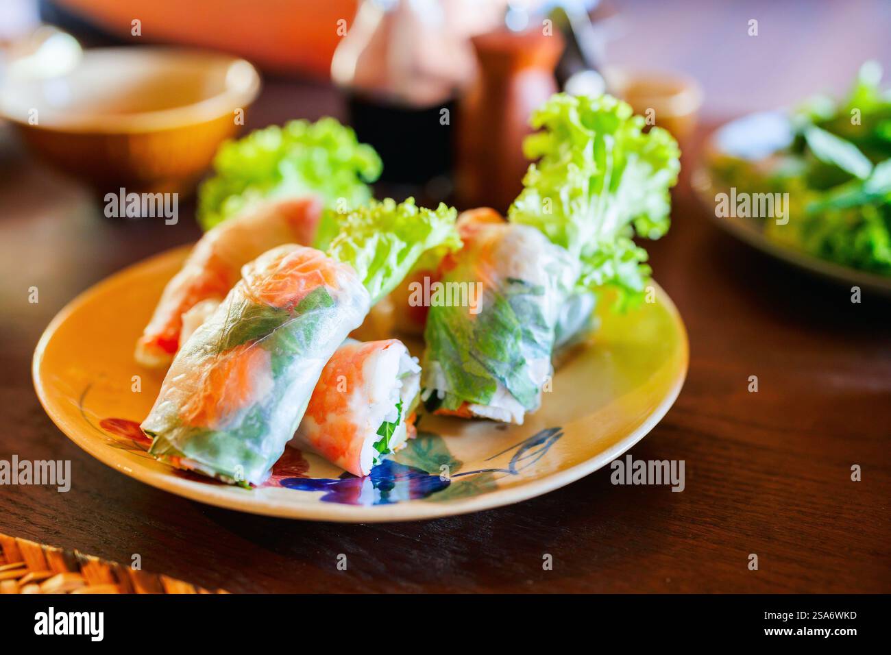Traditional vietnamese spring rolls served with other small bites for ...