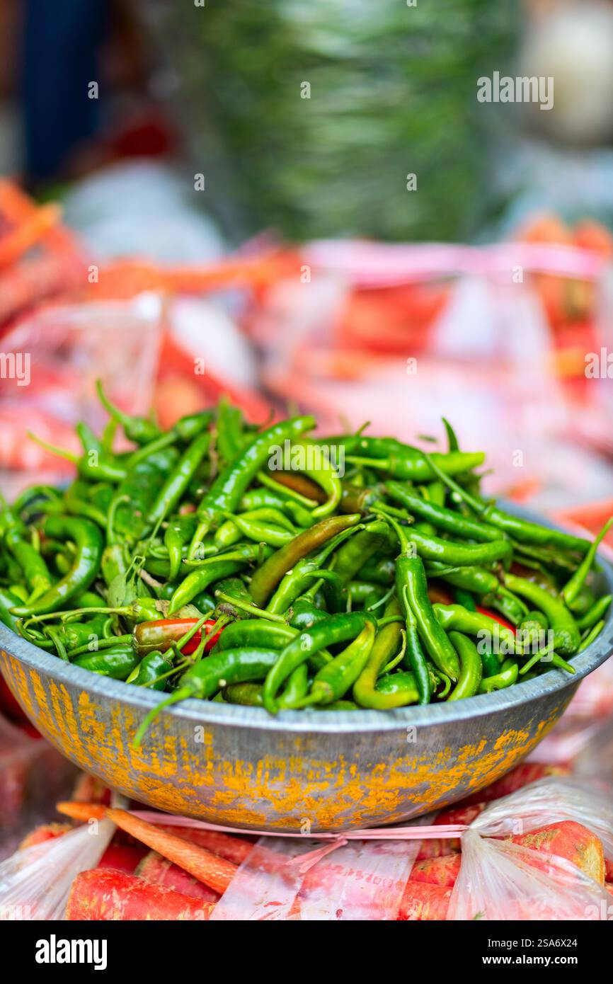 Green hot chili peppers at street vegetable market in Jaipur India ...
