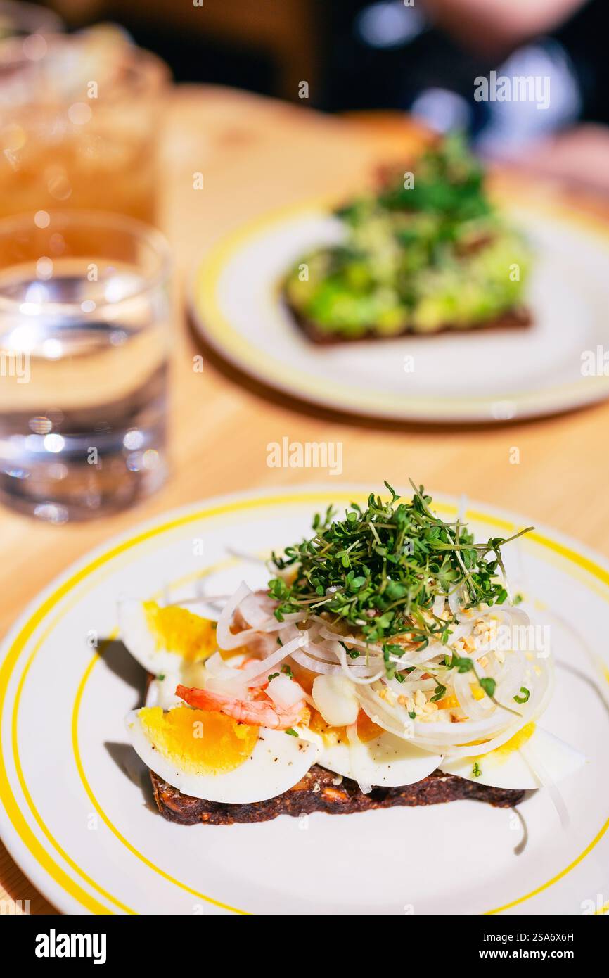 Danish smorrebrod traditional open sandwich with eegs and shrimps on rye bread Stock Photo - Alamy
