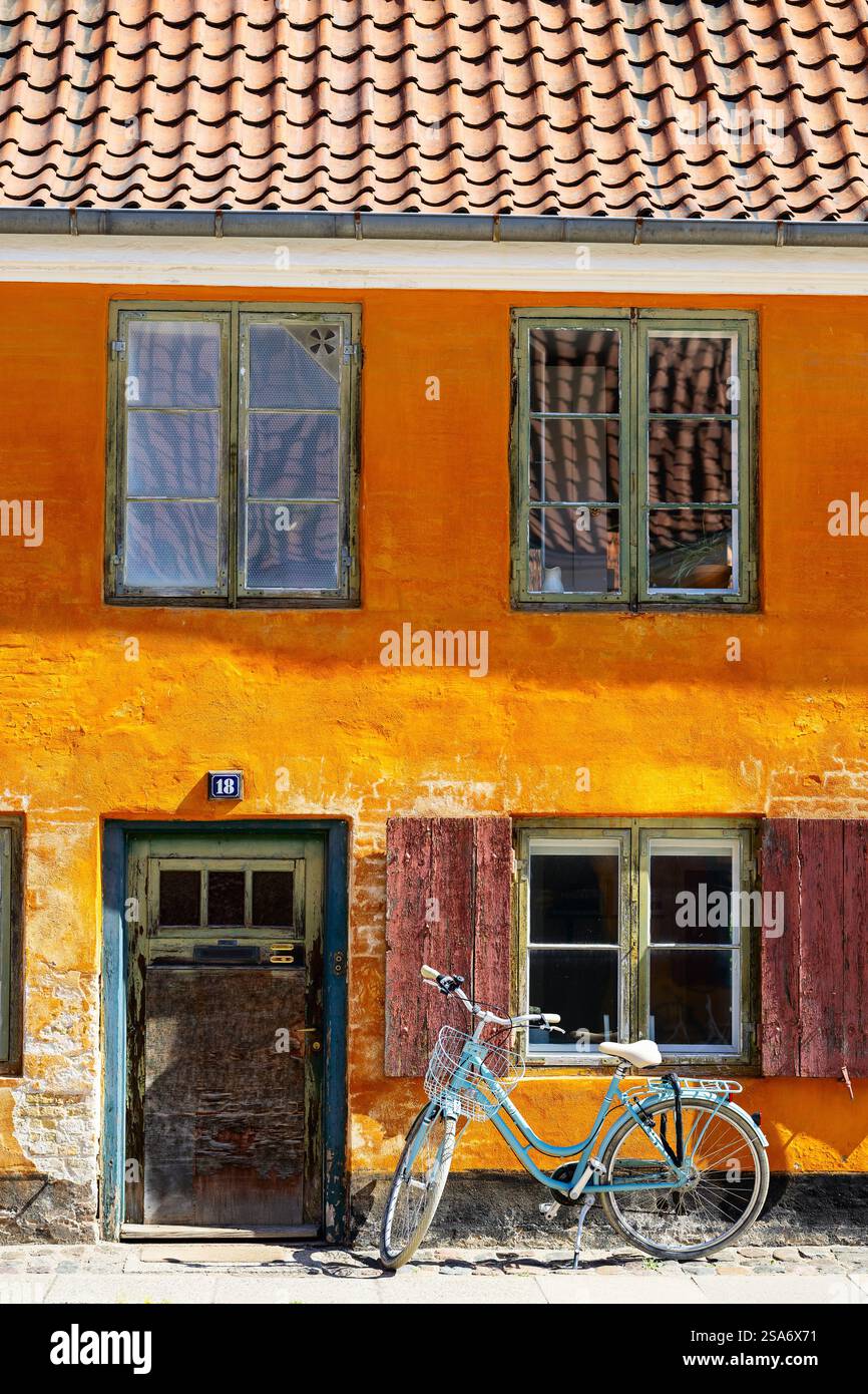 Traditional colorful yellow house in Copenhagen historic district of ...