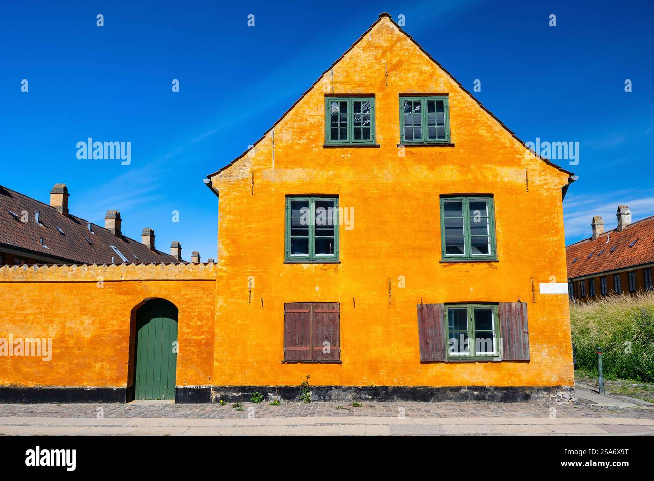 Traditional colorful yellow house in Copenhagen historic district of ...