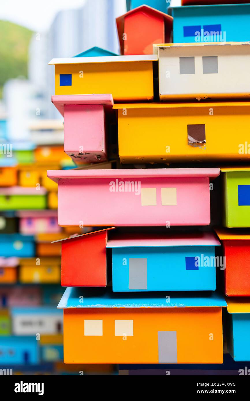 A vibrant arrangement of miniature, colorful house models resembling ...