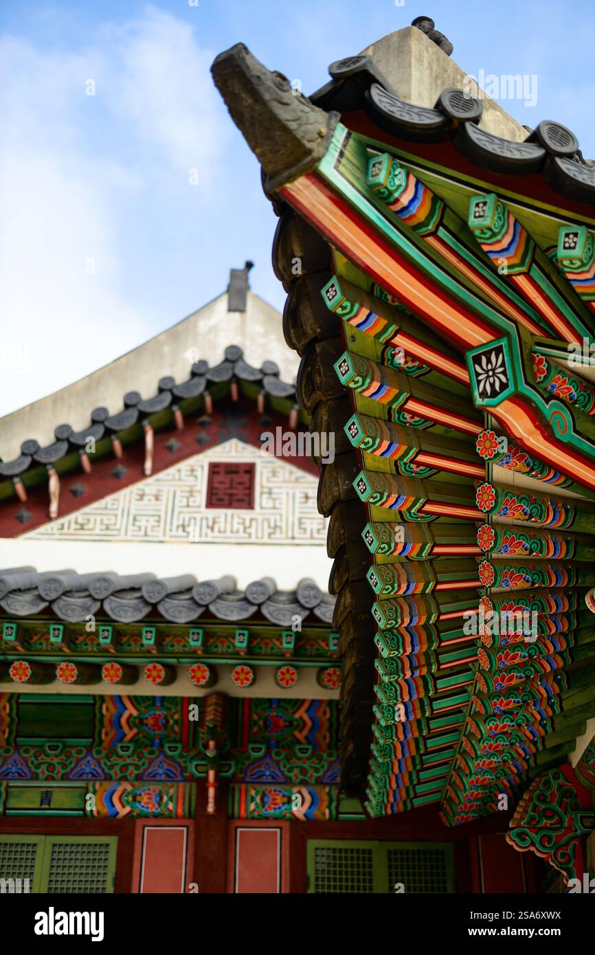 A close-up view of a traditional Korean temple roof showcasing vibrant ...