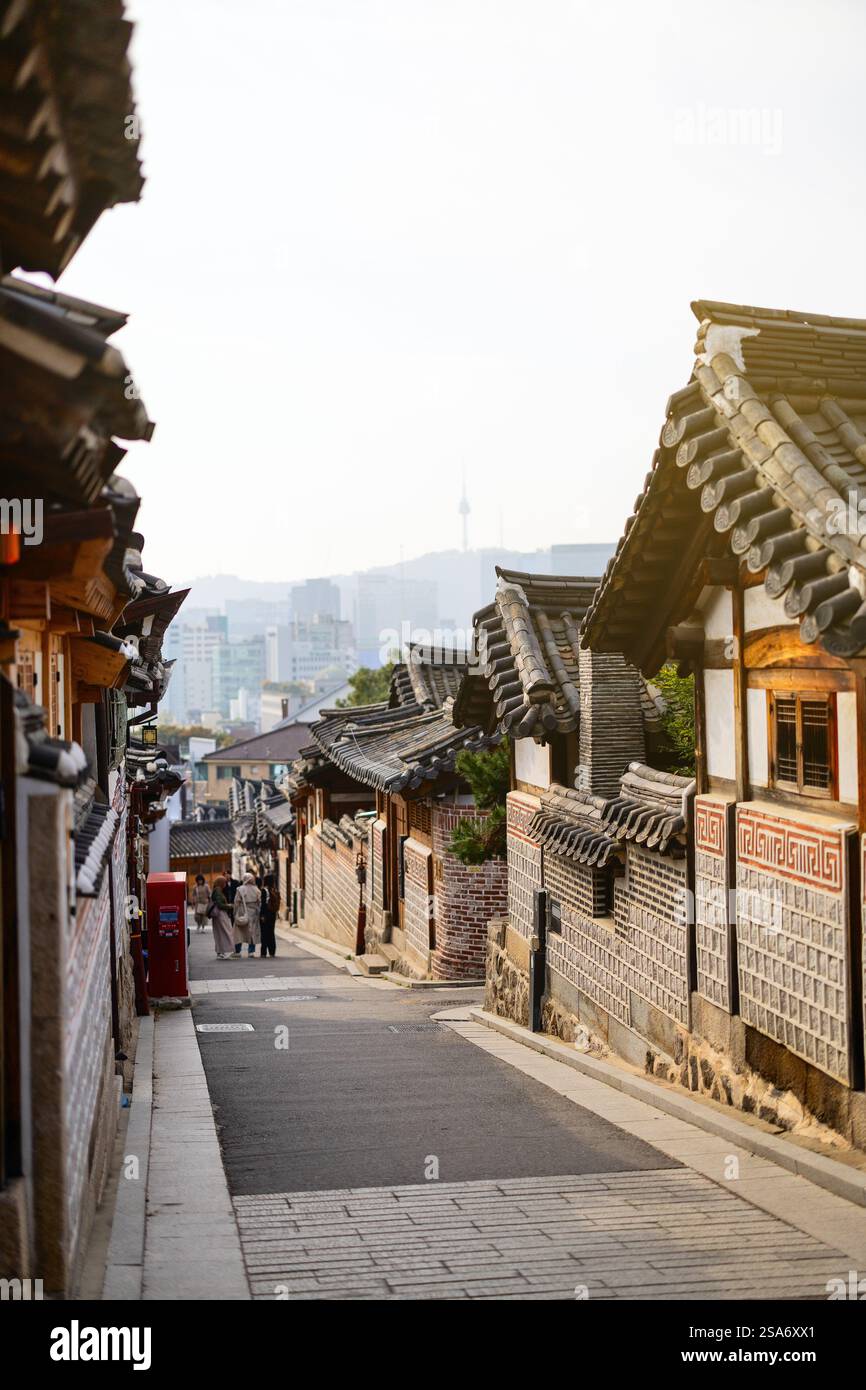 A serene street in Bukchon Hanok Village, Seoul, lined with traditional ...