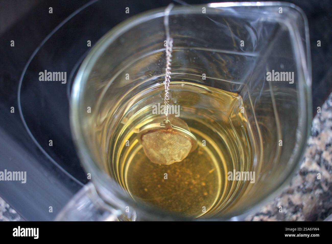making a healthy green tea at home after lunch Stock Photo - Alamy
