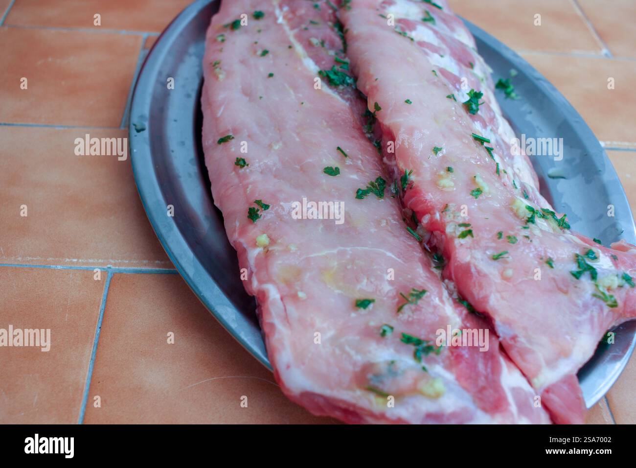 pork meat ready to be grilled at home with friends Stock Photo - Alamy