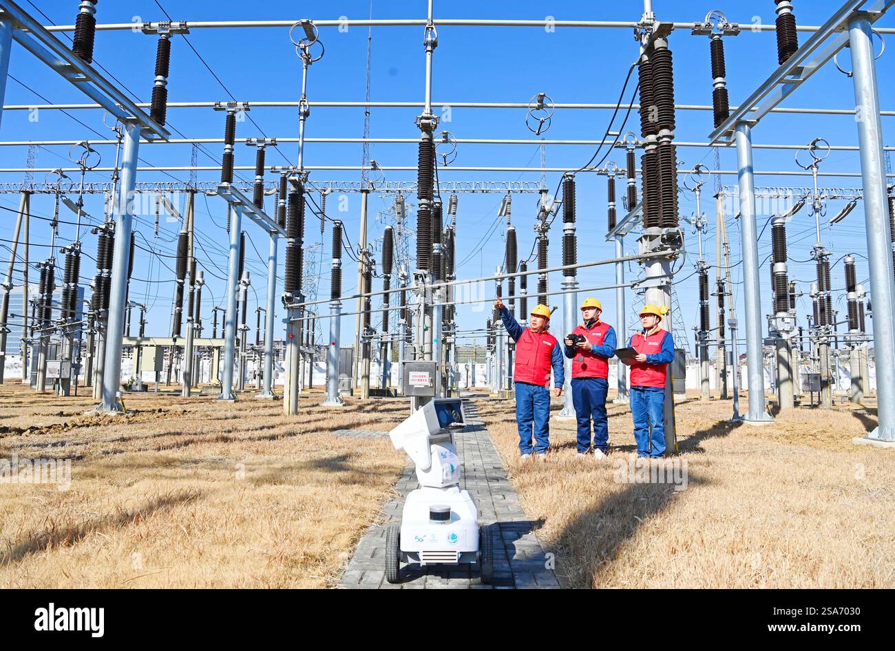 A 5G intelligent inspection robot and staff use a drone to conduct a ...