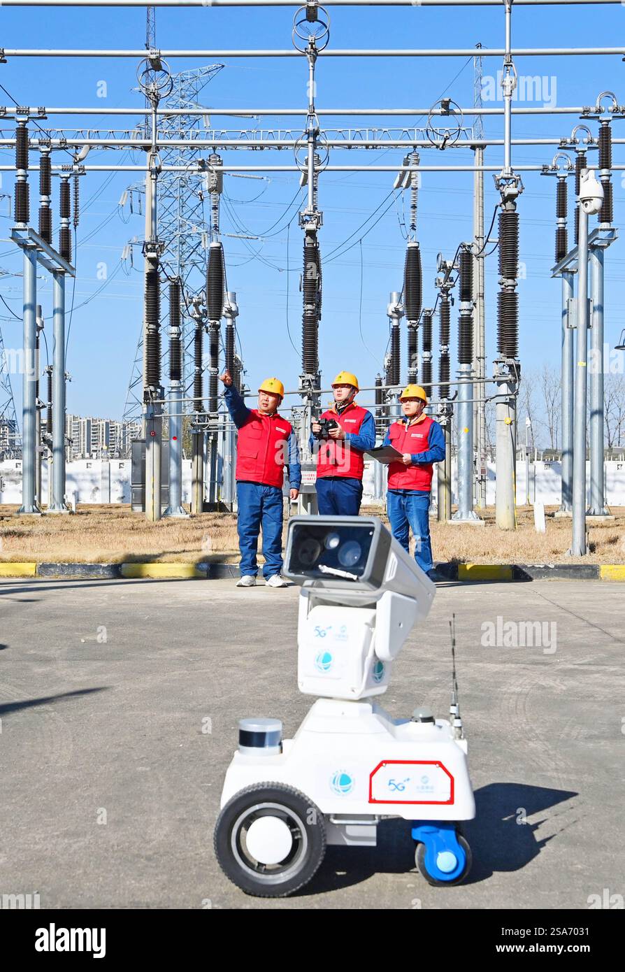 A 5G intelligent inspection robot and staff use a drone to conduct a ...