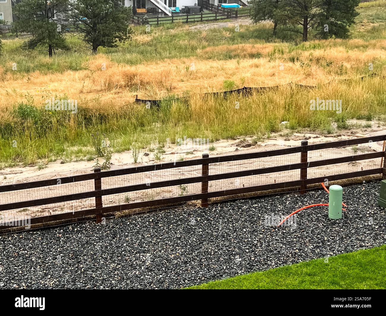 Backyard Fence Near Flooded Drainage Area Stock Photo - Alamy
