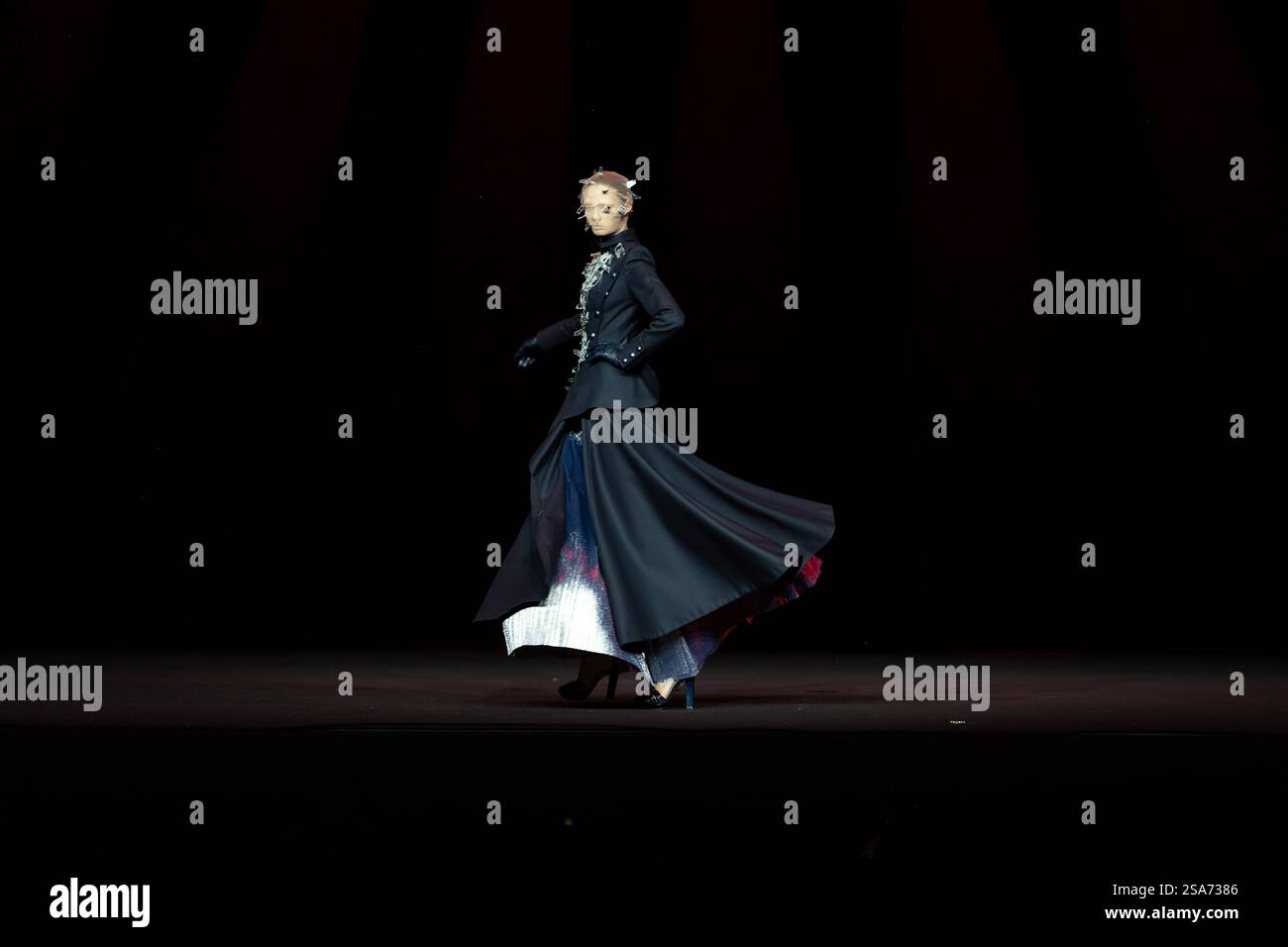 PARIS, FRANCE - JANUARY 28 Models pose on the runway during the Julien ...